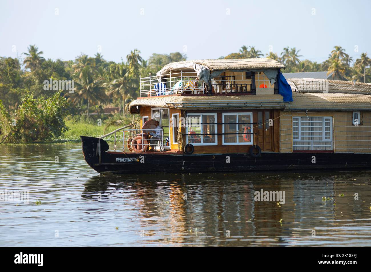 Traditional houseboat on Lake Vembanad, canal system of the backwaters ...
