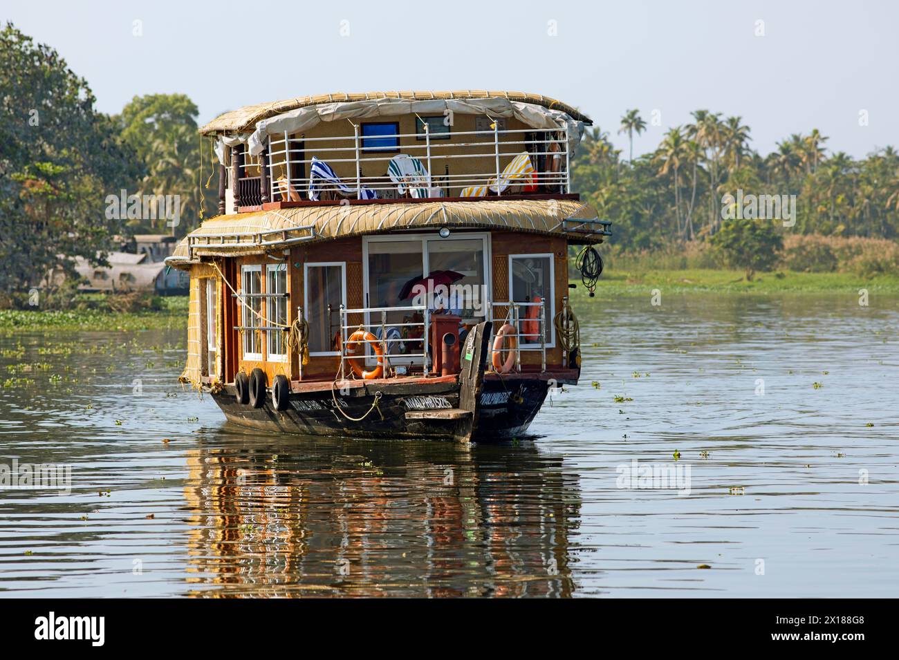 Traditional houseboat on Lake Vembanad, canal system of the backwaters ...