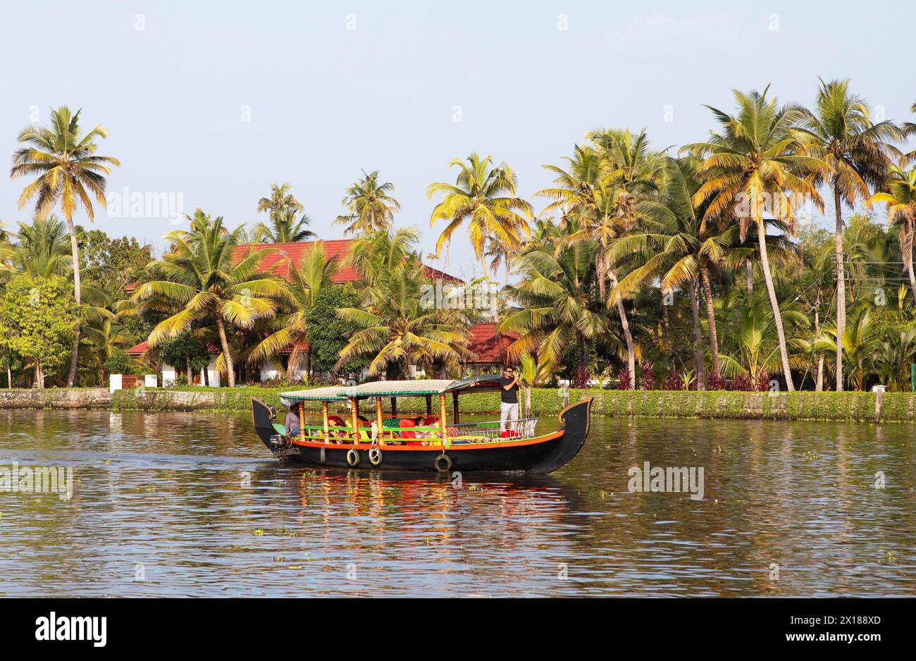 Traditional shikara boat on a canal in the canal system of the ...
