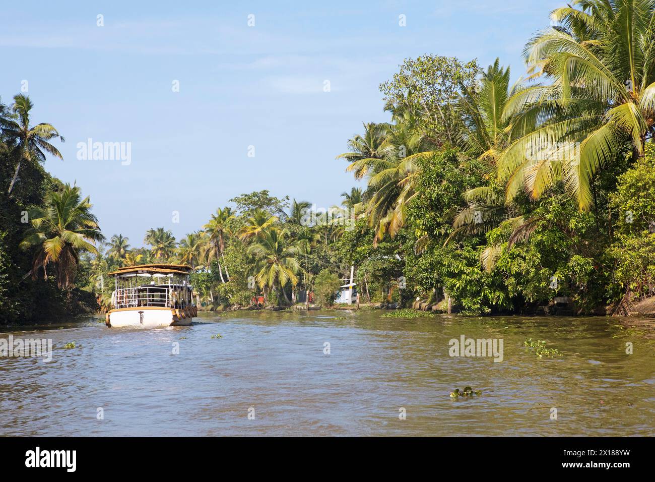 Traditional shikara boat on a canal in the canal system of the ...