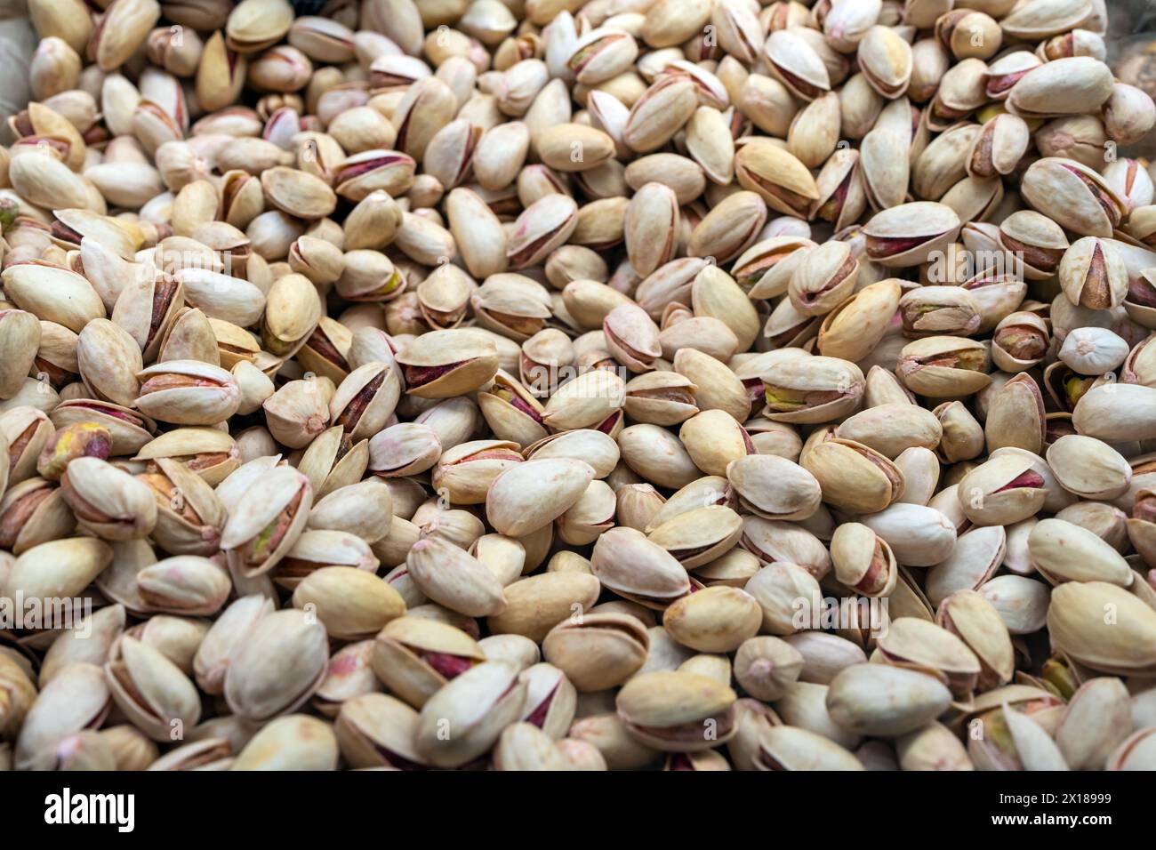 Pistachios texture and background. Roasted and salted pistachios in shell Stock Photo - Alamy