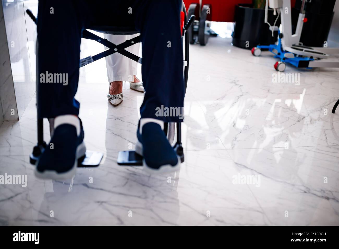 Feet of a woman pushing a wheelchair in Villajoyosa Stock Photo - Alamy