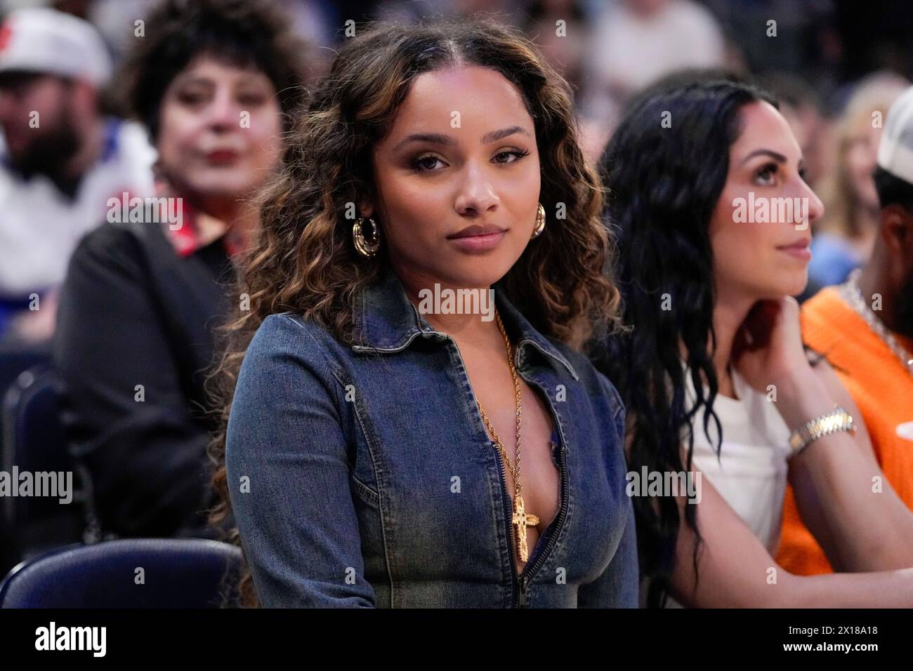Actress Jaylen Barron sits courtside during the second half of an NBA ...