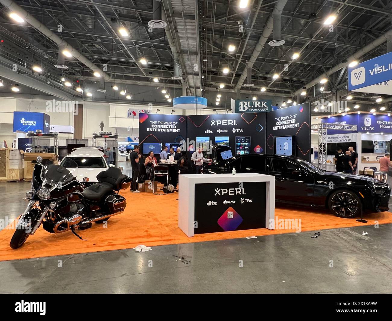 Las Vegas, USA. 15th Apr, 2024. People visit the booth of XPERI for digital HD Radio at NAB Show ...