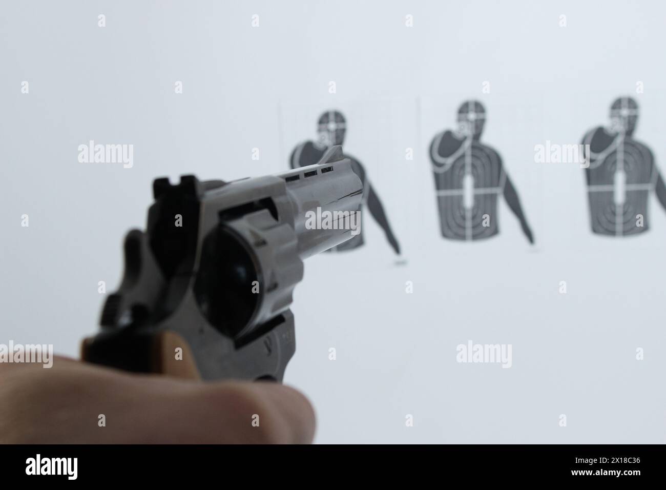 The revolver is aimed at the shooting target Stock Photo - Alamy