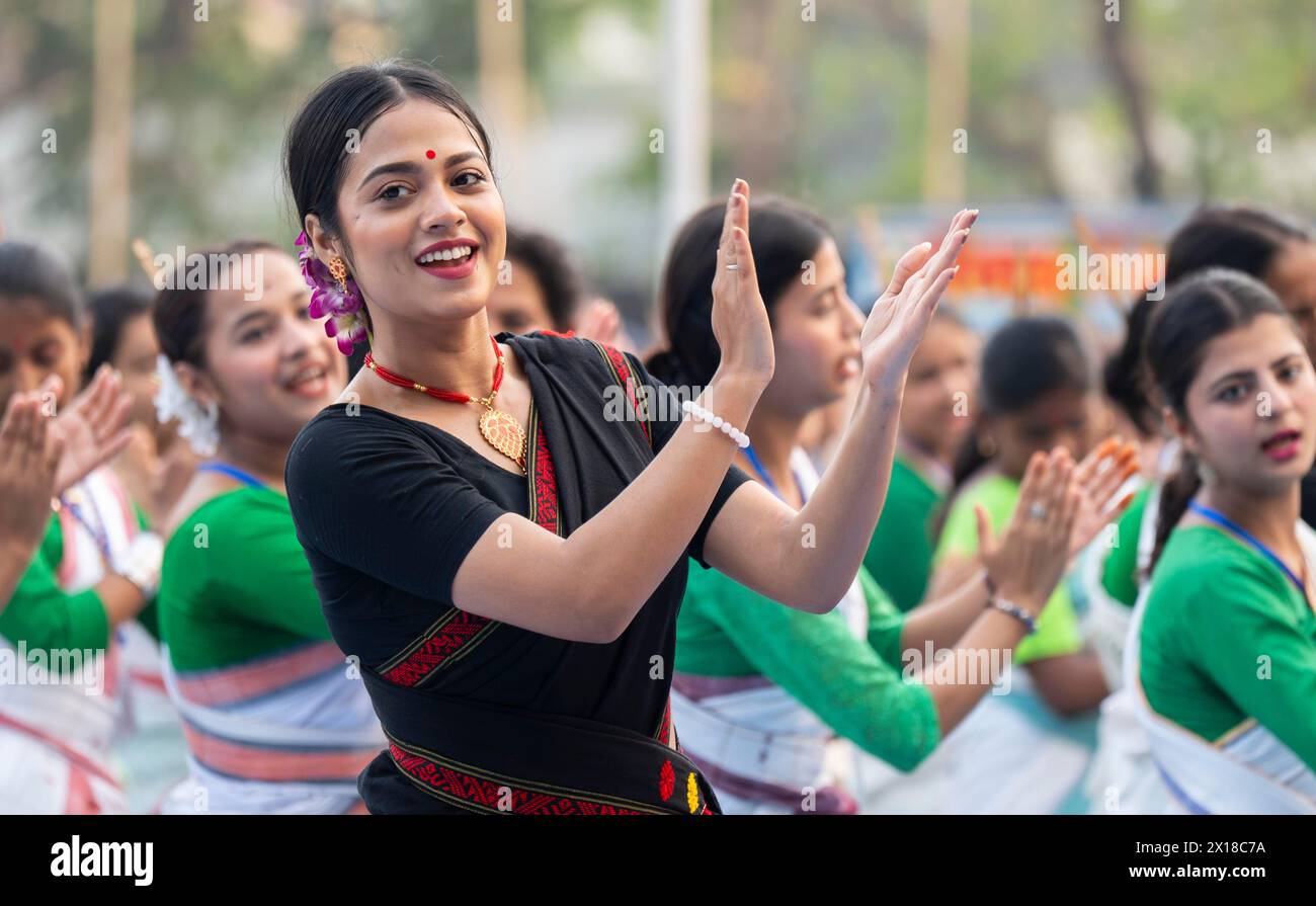 An instructor dance Bihu, as she teach participants during a Bihu dance ...