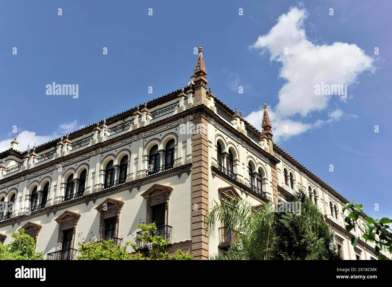 Seville, Historic building with gothic style elements and blue sky ...