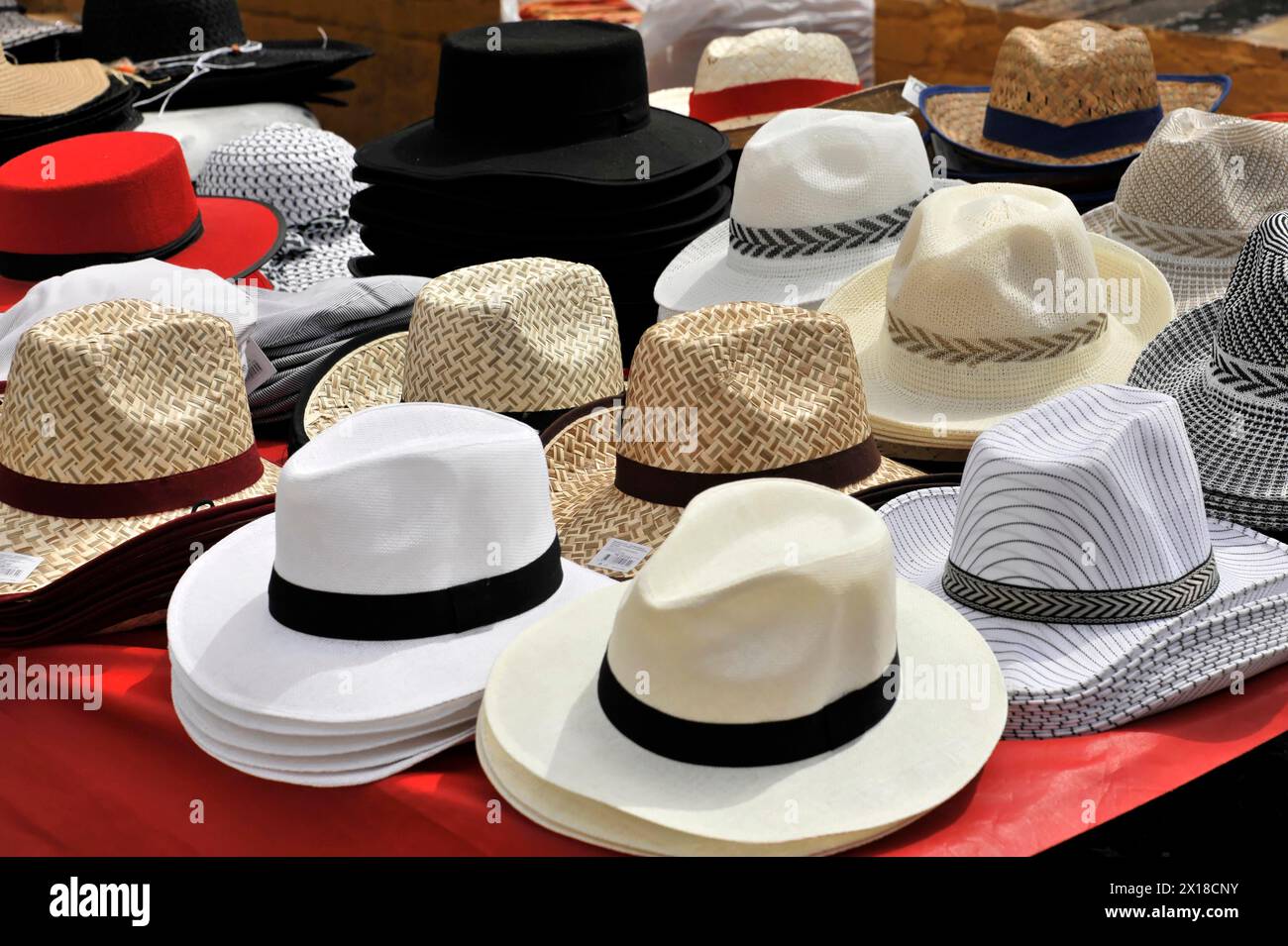 Seville, A selection of different hats displayed on a market stall ...