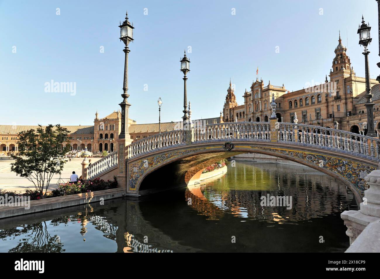 Plaza de Espana, Seville, Reflection of a decorative bridge and ...