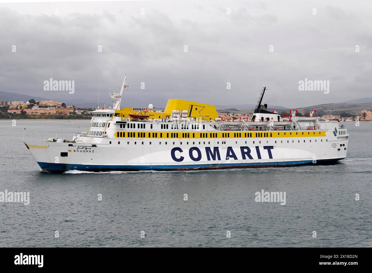 CEUTA, Yellow COMARIT ferry sailing on the sea with slightly moving ...