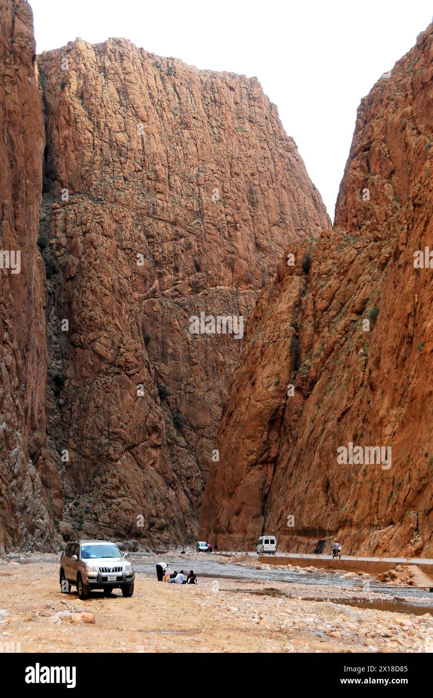 Todra Gorge, Vehicles in the Todra Gorge surrounded by steep rock faces ...