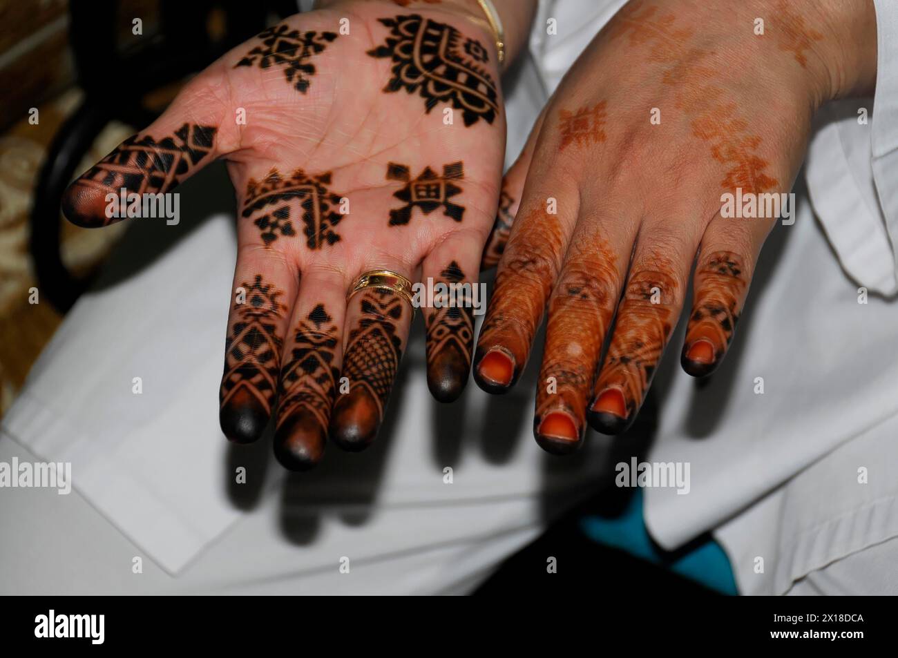 Marrakech, Hands with detailed henna paintings as part of a festive ...