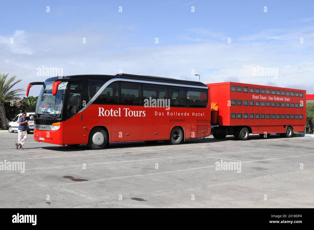 Essaouira, A large red coach from Rotel Tours with a coupled trailer as ...