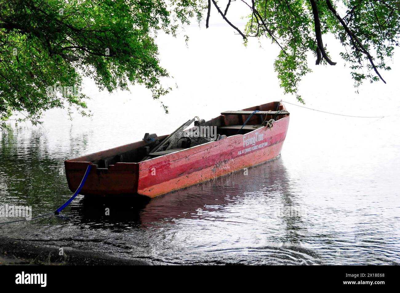 Ometepe Island, Nicaragua, Old rust-coloured rowing boat tied under ...