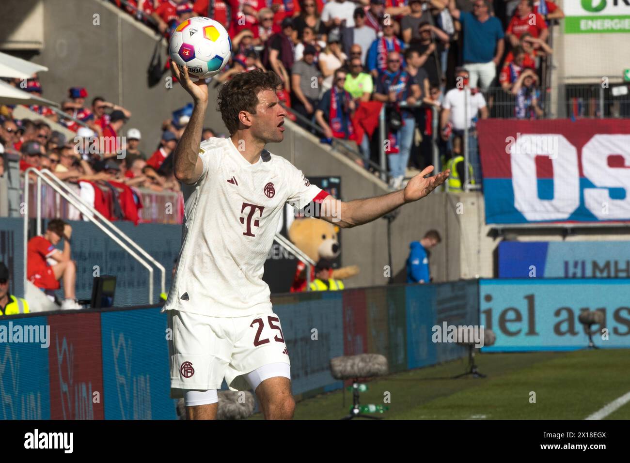 Football match, captain Thomas MUeLLER Bayern Munich with the ball in ...