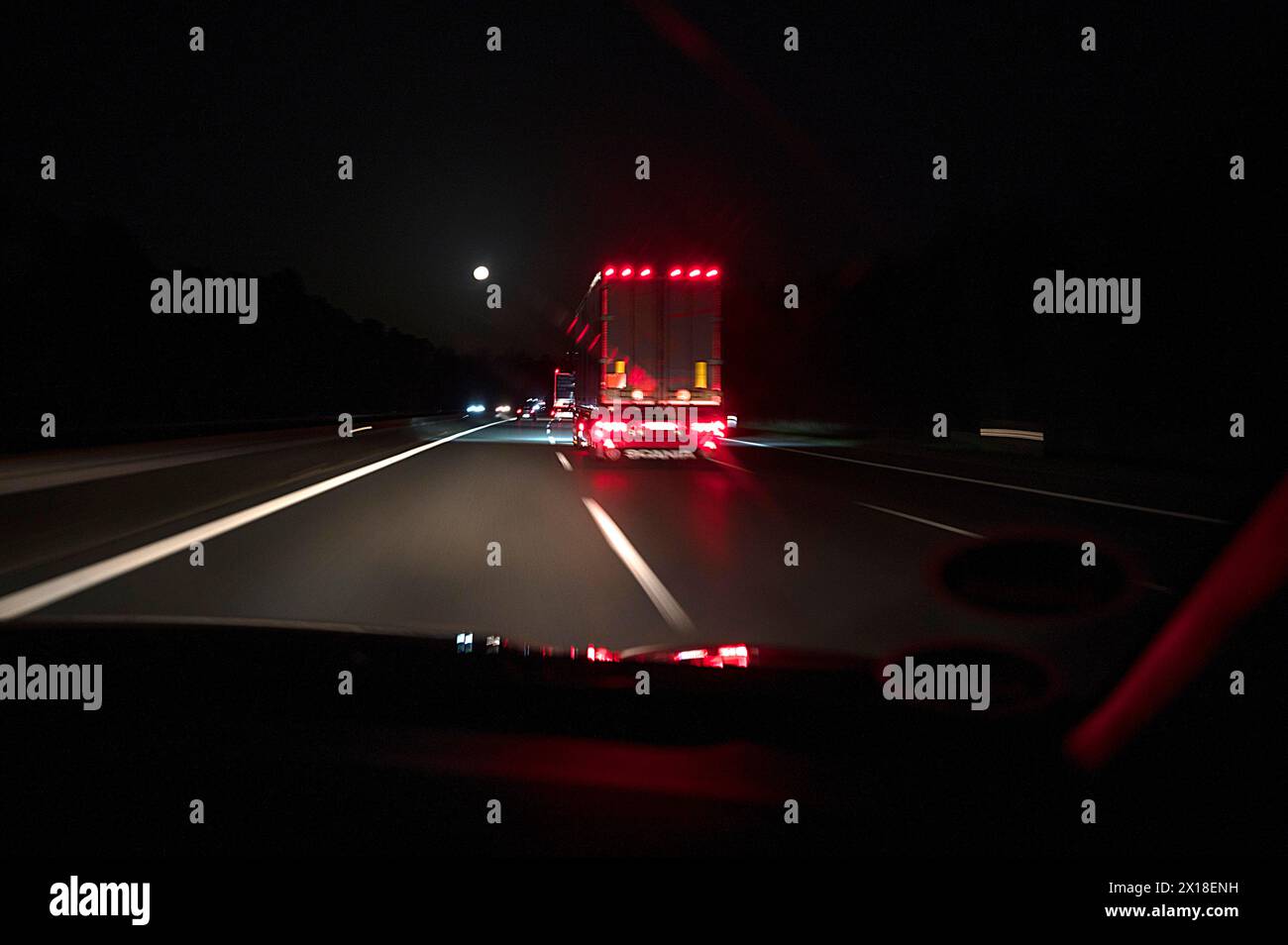 Night-time road scene with lorries on the motorway, Bavaria, Germany ...