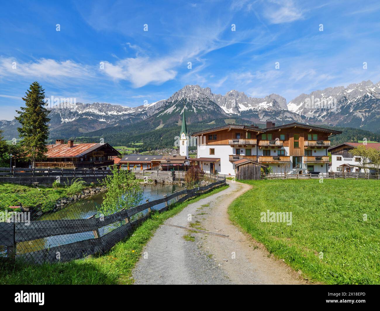 View of the parish church in Ellmau am Wilden Kaiser, beautiful weather ...