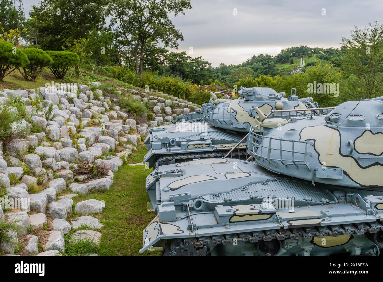 Closeup of gun turret on military tanks with camouflage paint on ...