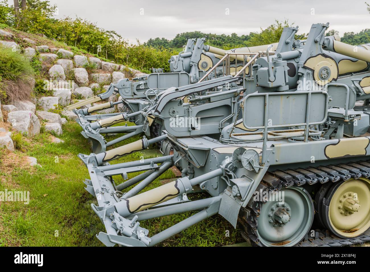 Rear view of military tanks in camouflage paint on display in public ...