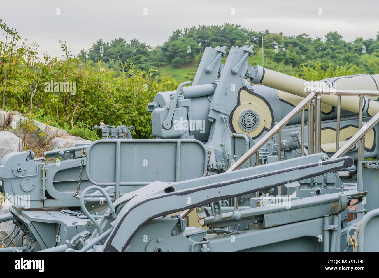 Side view of gun controls of military tank on display in public park in ...