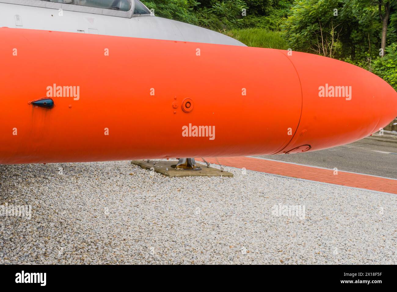 Closeup of wingtip fuel tank on small jet engine trainer on displayat ...