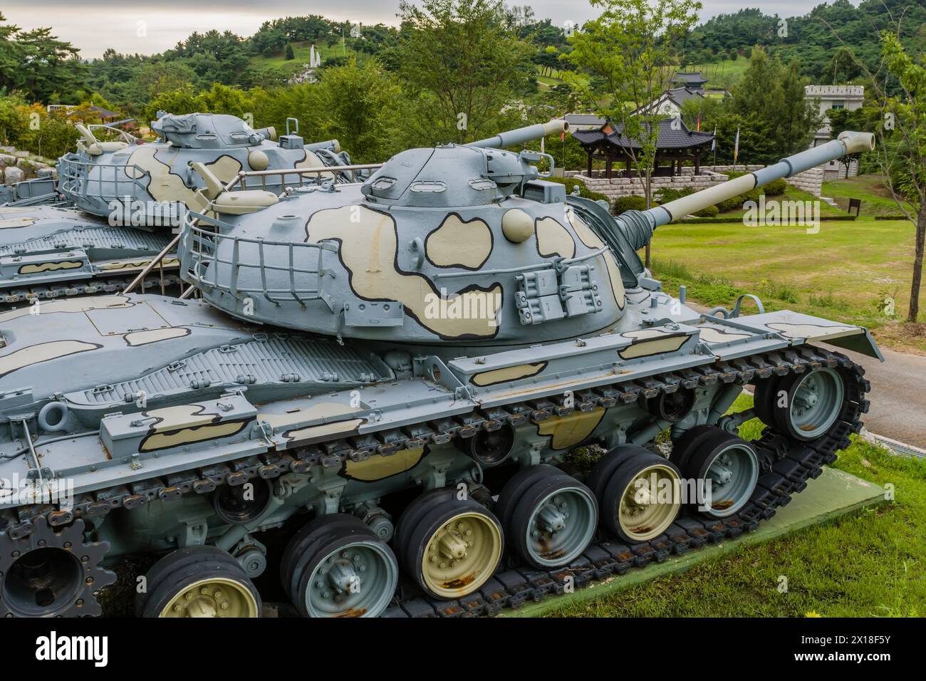 Military tanks with camouflage paint on display in public park in ...