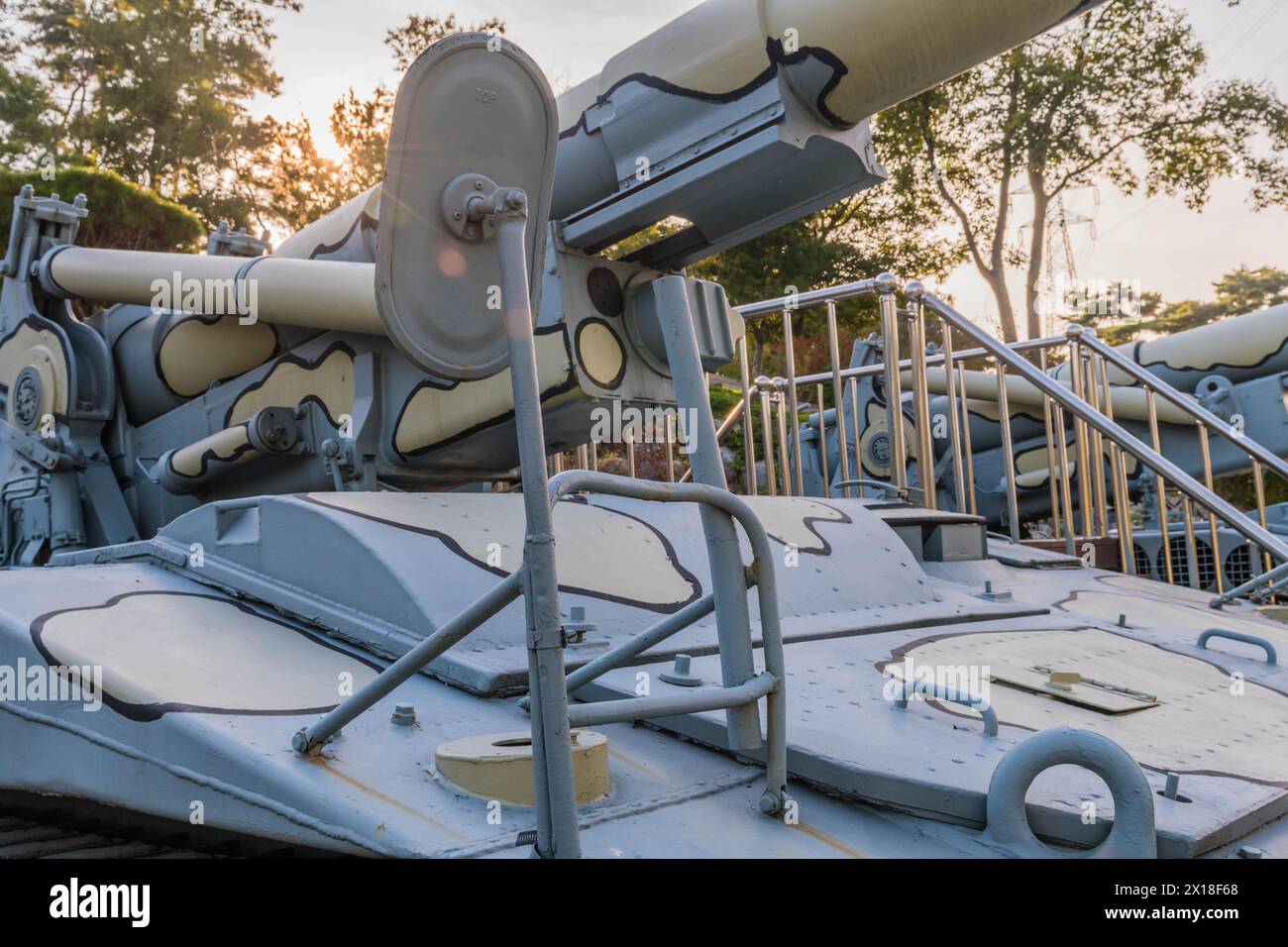 Closeup of top of camouflaged tank with view of hatch under gun barrel ...
