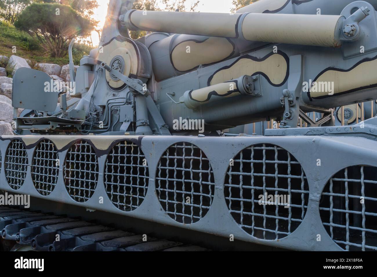 Closeup of camouflaged army tank with side view of vents above track ...