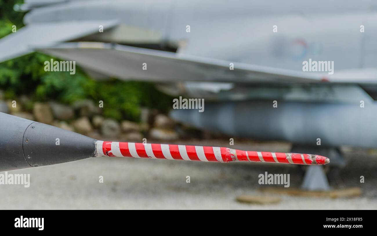 Closeup of red and white pitot-tube on front of jet aircraft used for ...