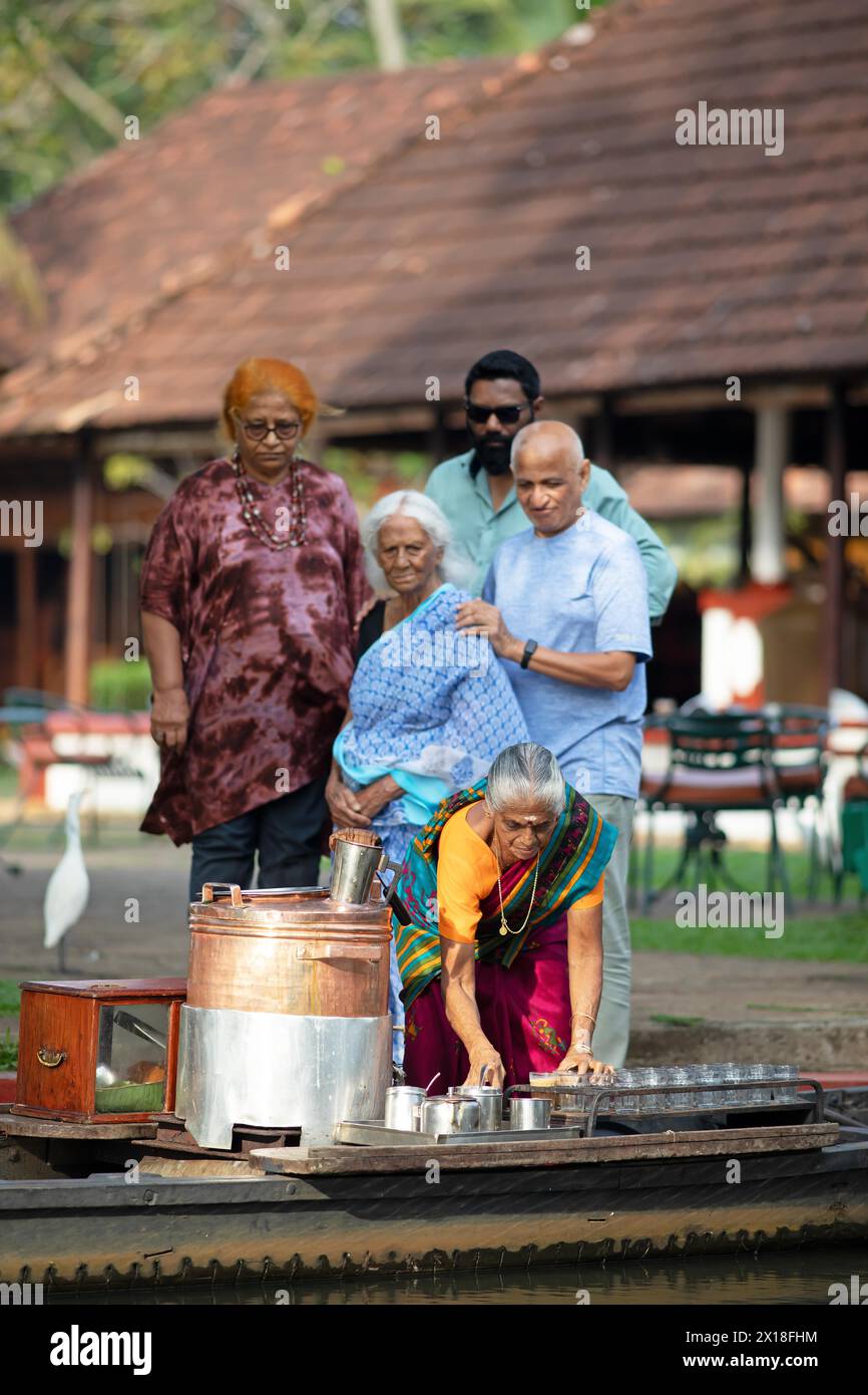 Tealady, 83 years old, making Indian tea on her boat, Backwaters ...