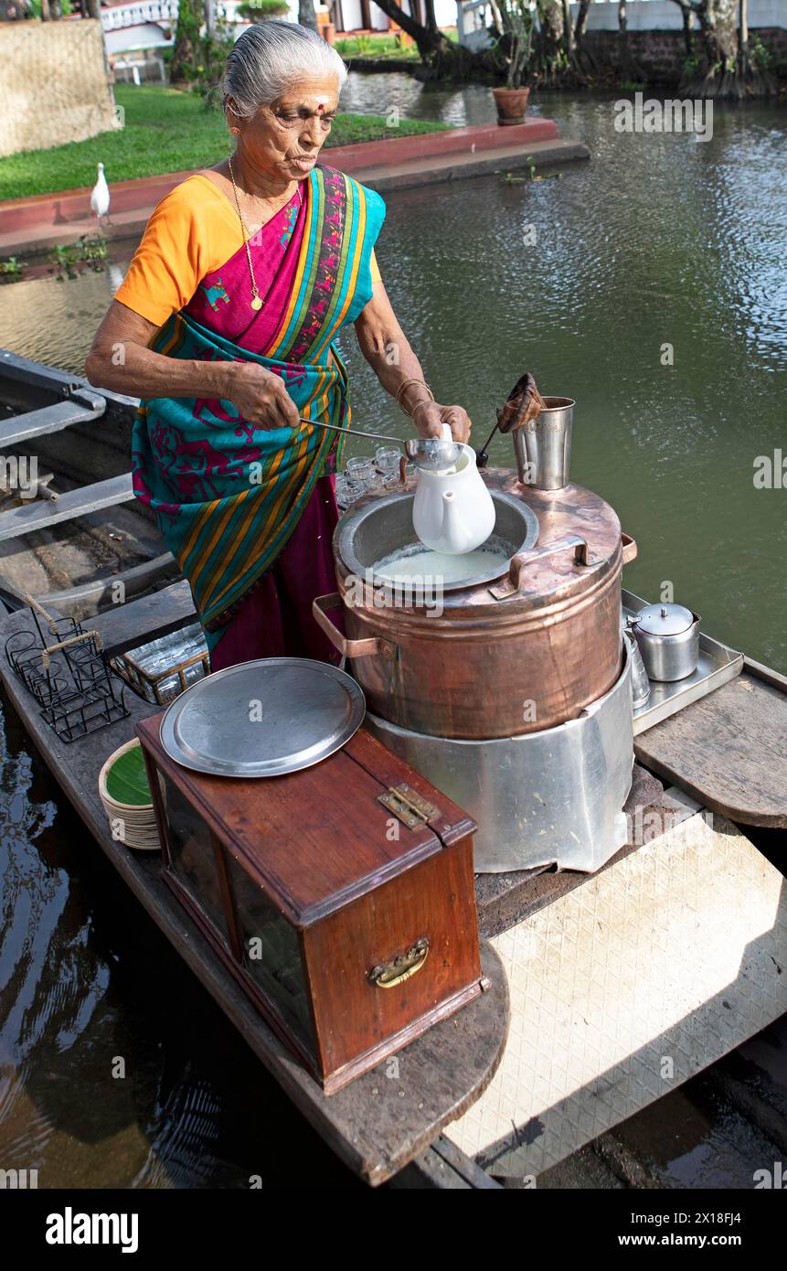 Tealady, 83 years old, making Indian tea on her boat, Backwaters ...