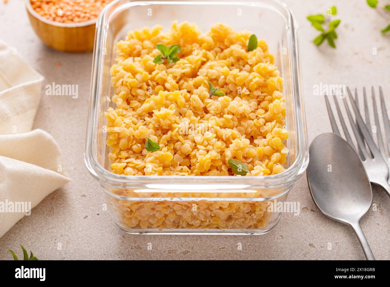Cooked red lentils in a meal prep container, healthy vegan protein ...