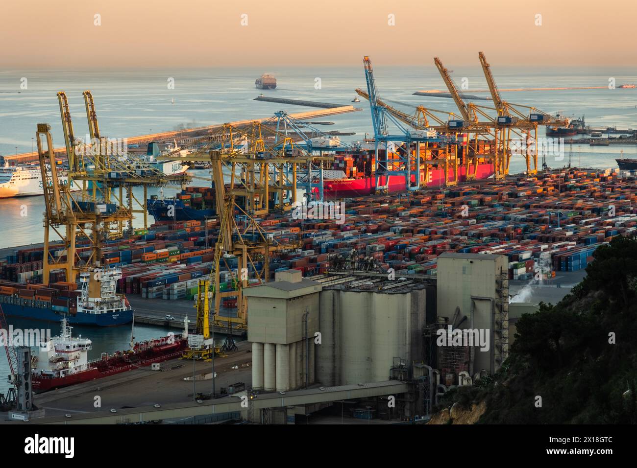 Container harbour in evening light in Barcelona, Spain Stock Photo - Alamy