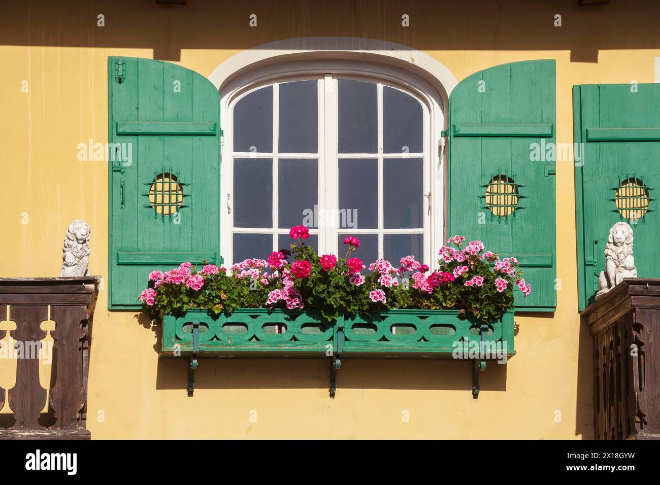 Old, green wooden window with shutters and flower box, Garmisch ...