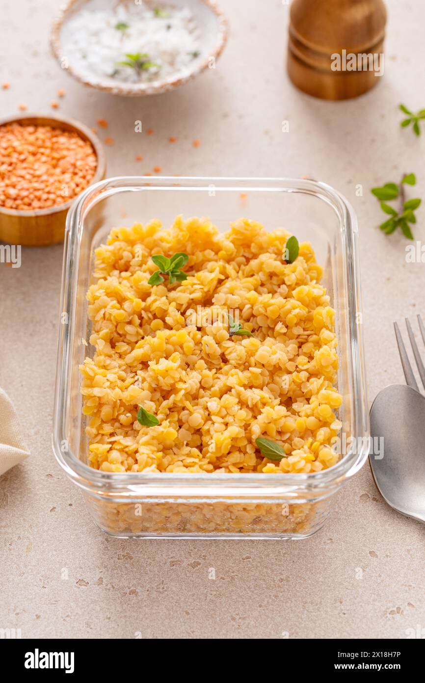 Cooked red lentils in a meal prep container, healthy vegan protein ...