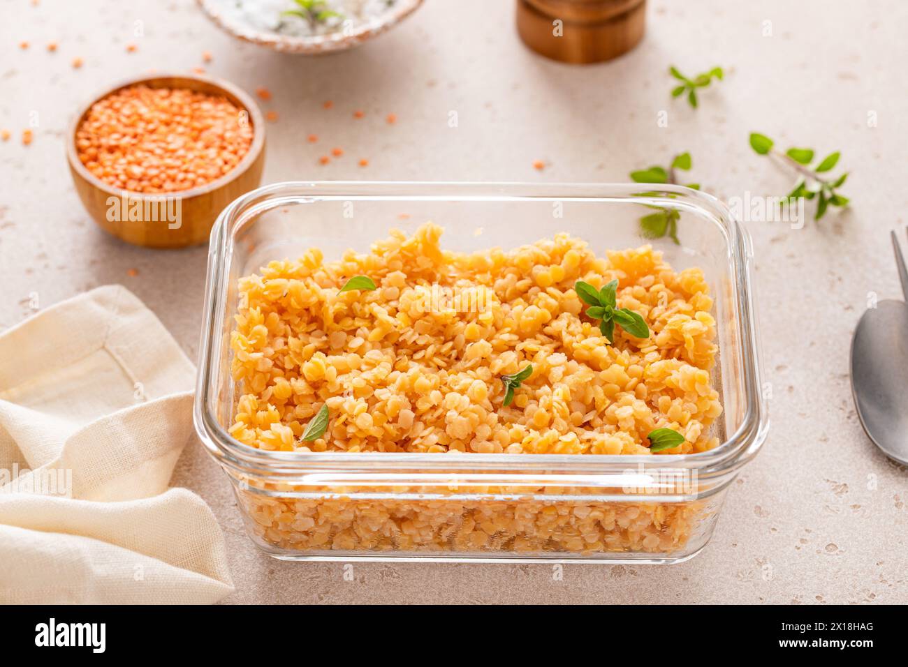 Cooked red lentils in a meal prep container, healthy vegan protein ...