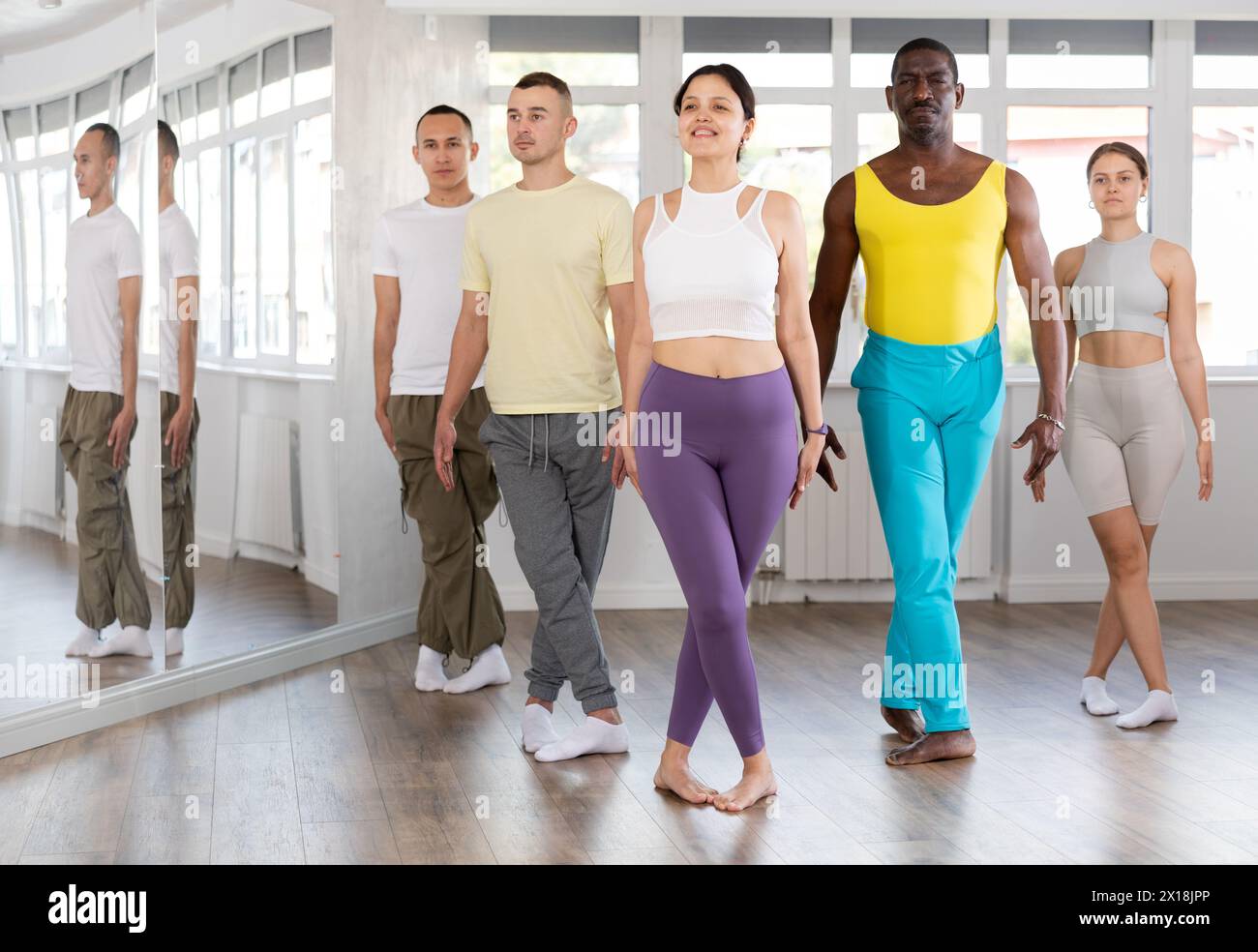 Young and middle-aged men and women practicing Irish dance in training ...