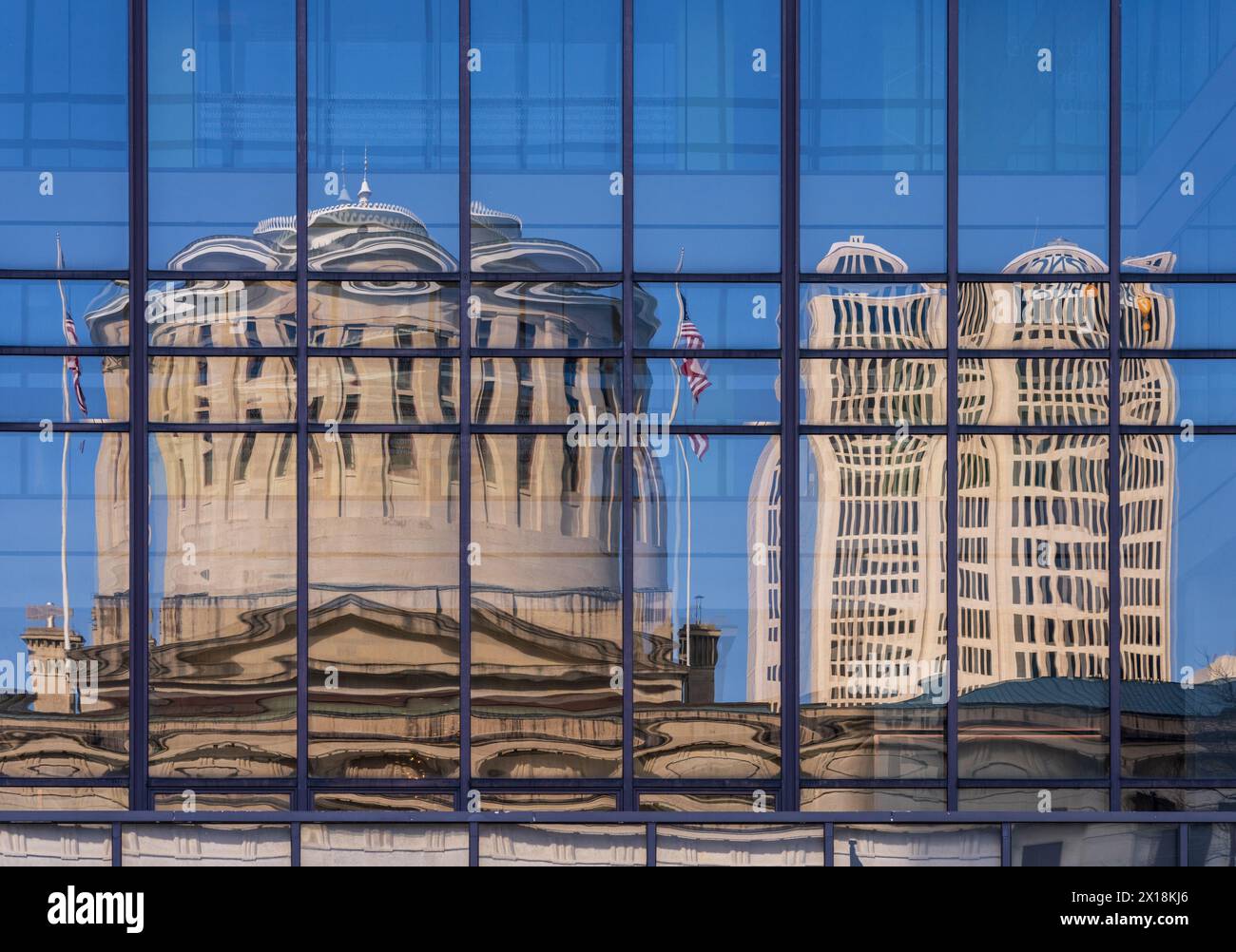 Reflection of the Ohio state Capitol building in the windows of an ...