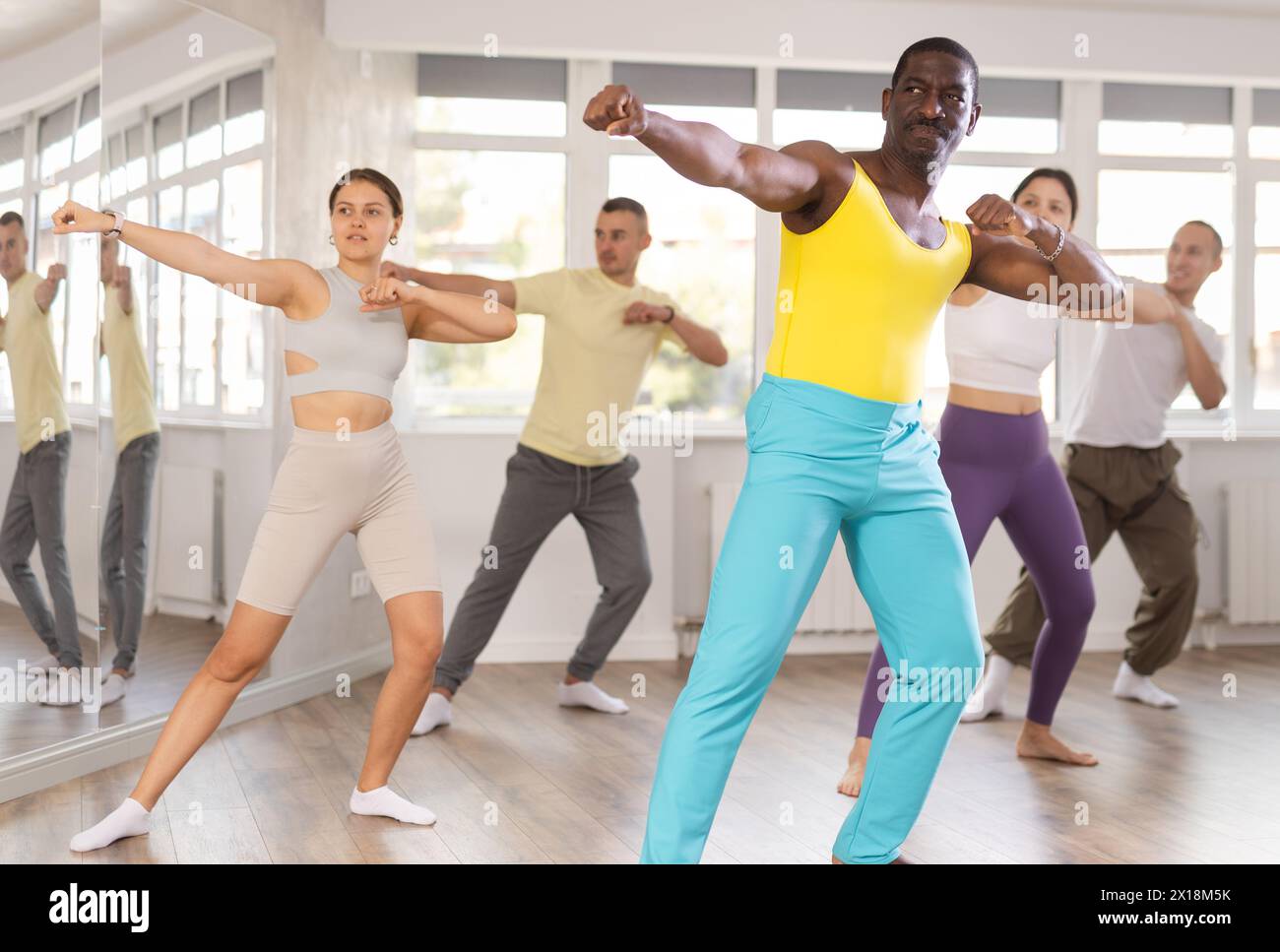 Middle-aged african-American man practicing Capoeira dance in training ...