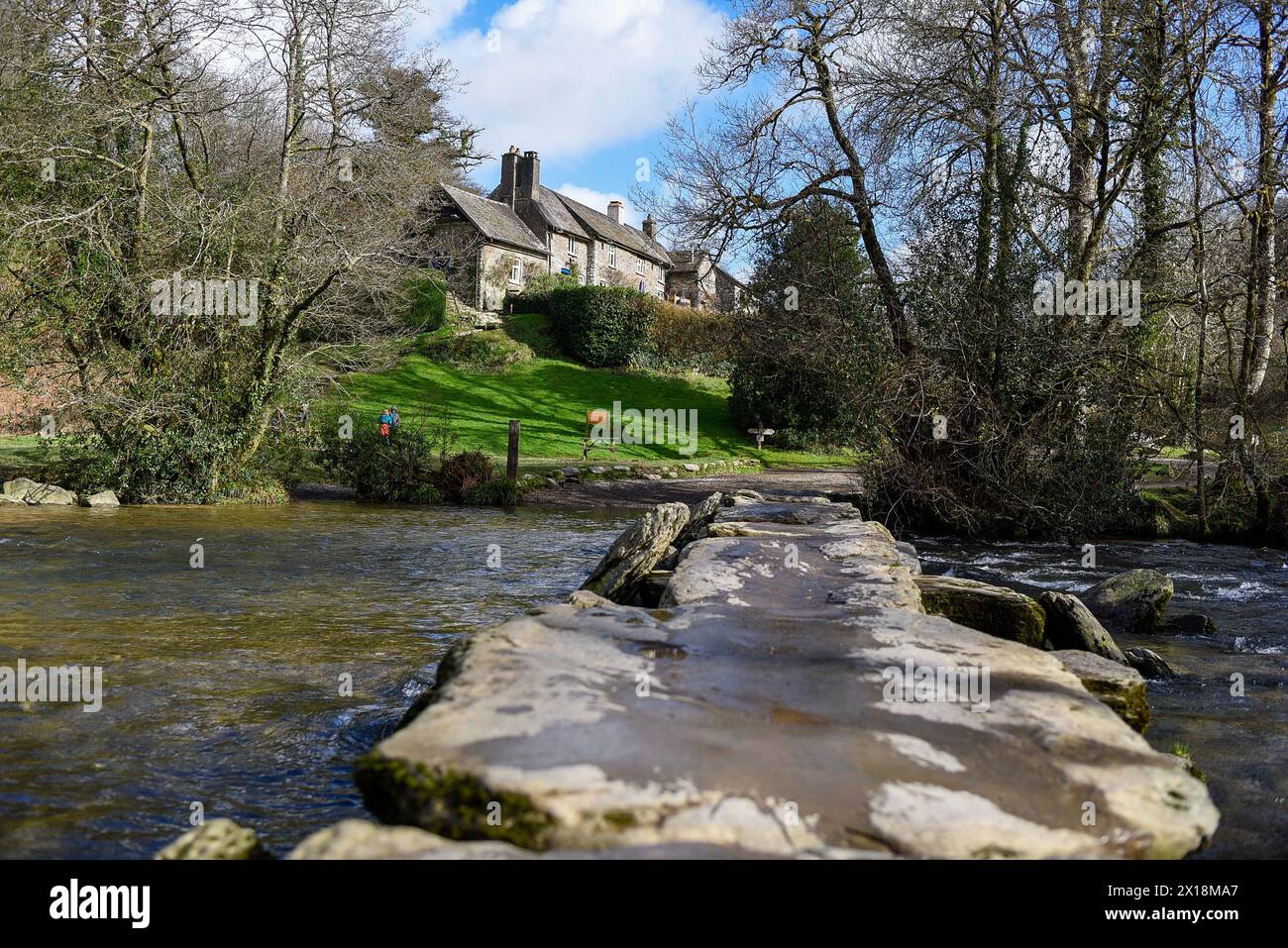 Stepping stones accross river in Devon with pub in background Devon uk ...
