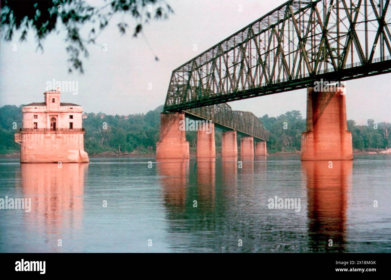 The V of the Old Chain of Rocks Bridge peaks in the Mississippi River ...