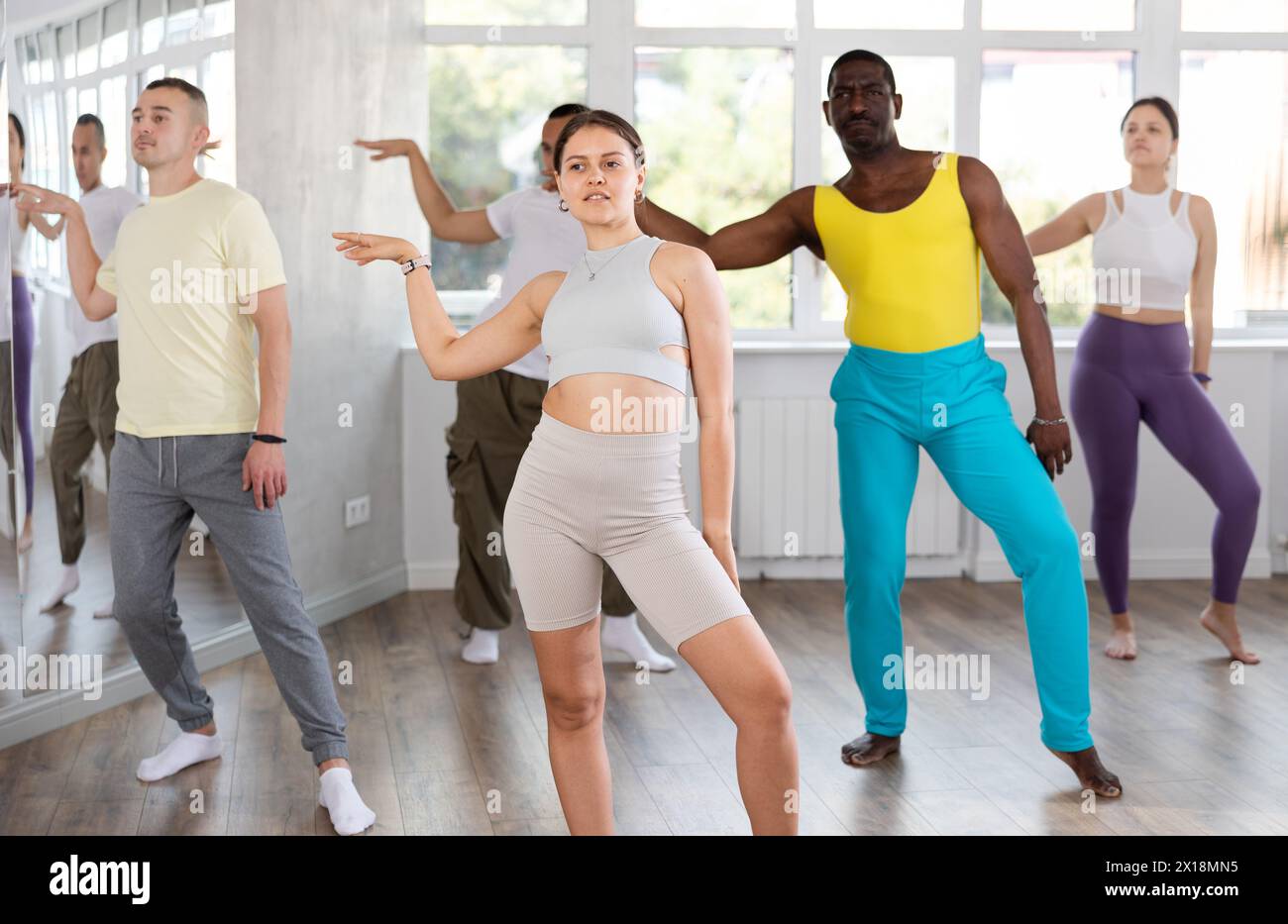 Smiling woman enjoying dance and training movements Latin dance bachata ...