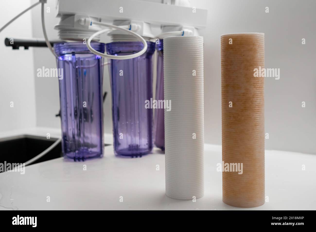 Dirty and clean filters for reverse osmosis on the table in the modern ...
