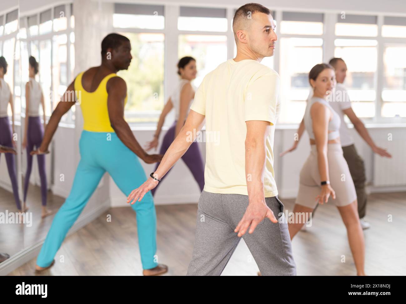 Young man practicing aerobic dance in training hall Stock Photo - Alamy