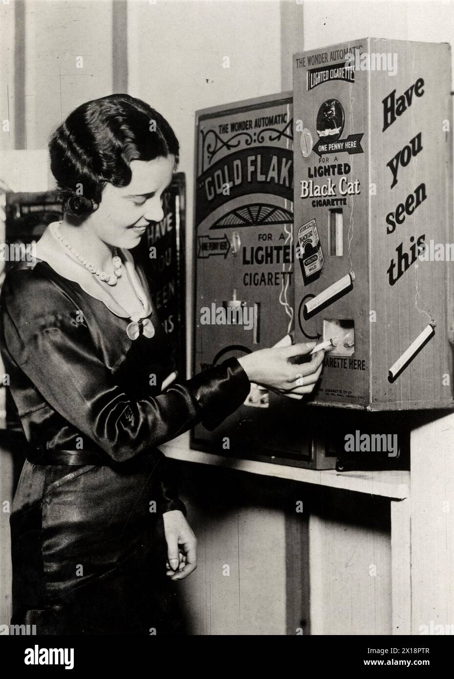 Cigarette vending machine that delivers a lighted (lit) cigarette for a ...