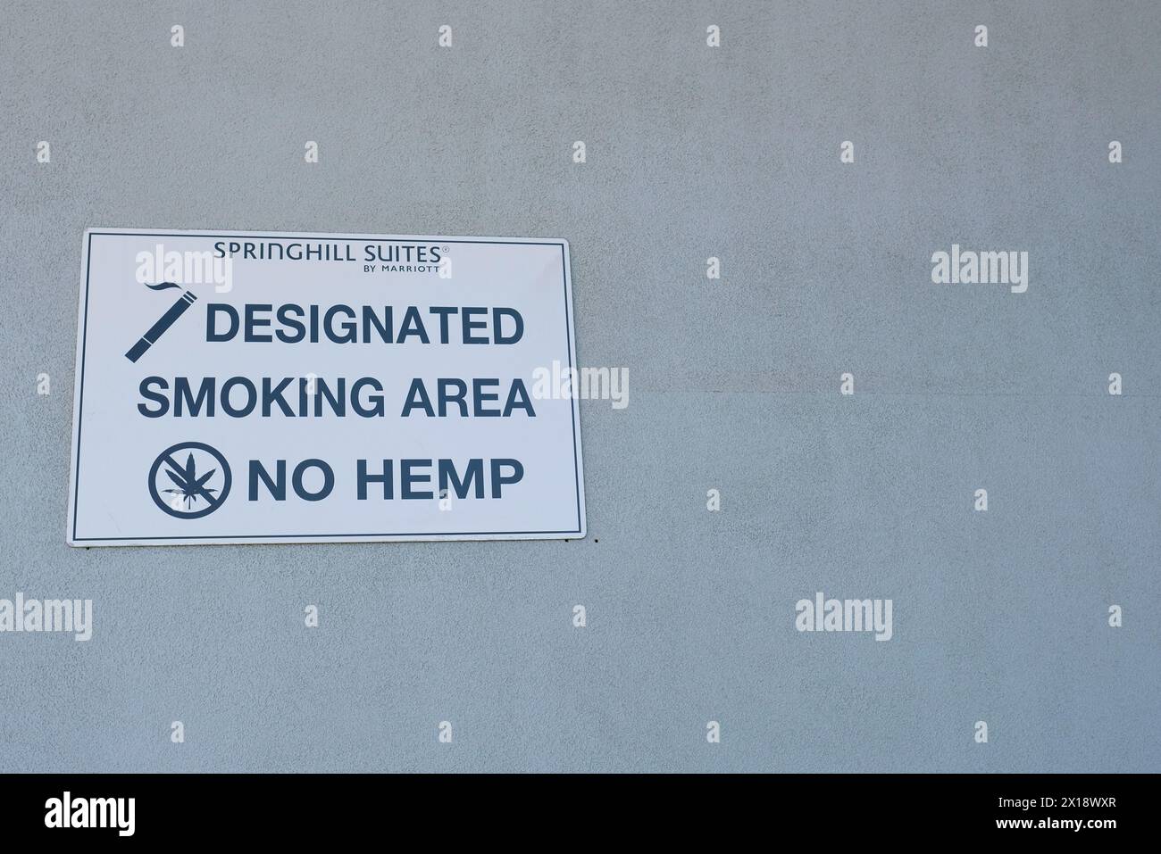 Designated smoking area, no hemp sign outside a Springfield Suites ...