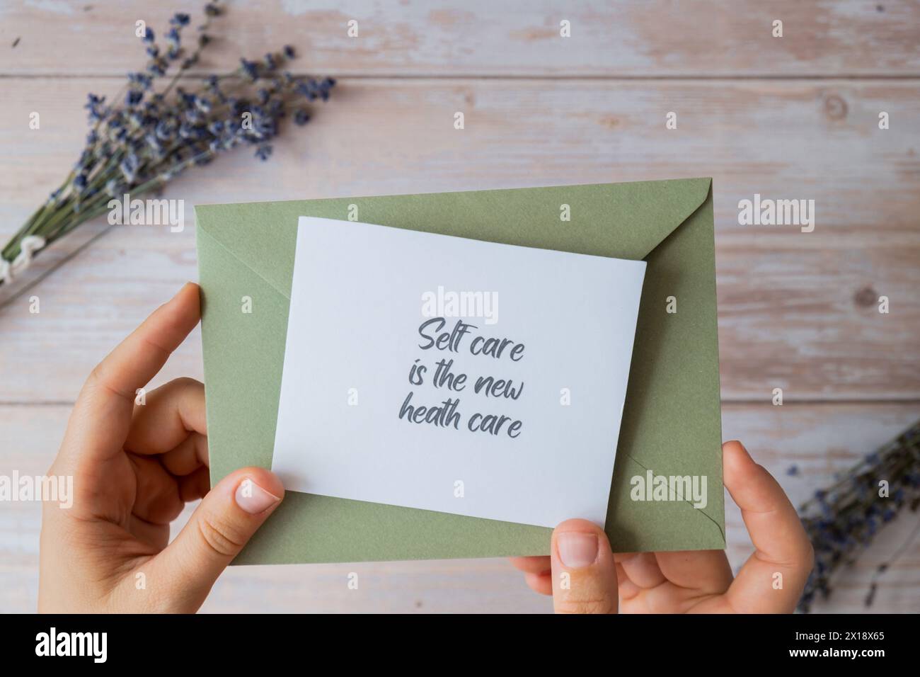 SELF CARE IS THE NEW HEALTH CARE text on supportive message paper note ...