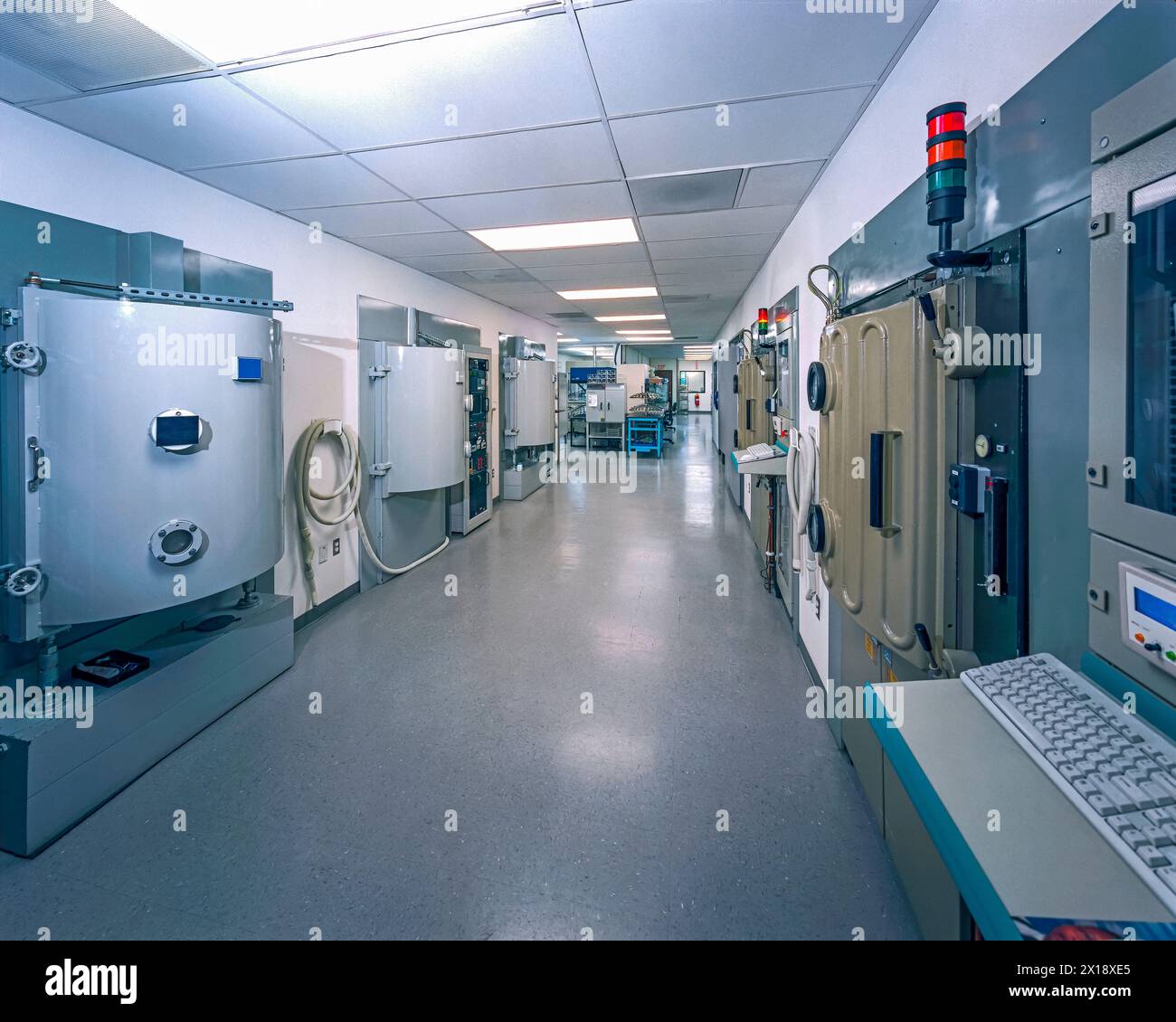 A corridor in an eyeglass manufacturer lined with various processing ...