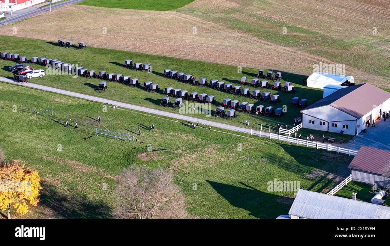 Captured from above, this image showcases an Amish community gathering ...