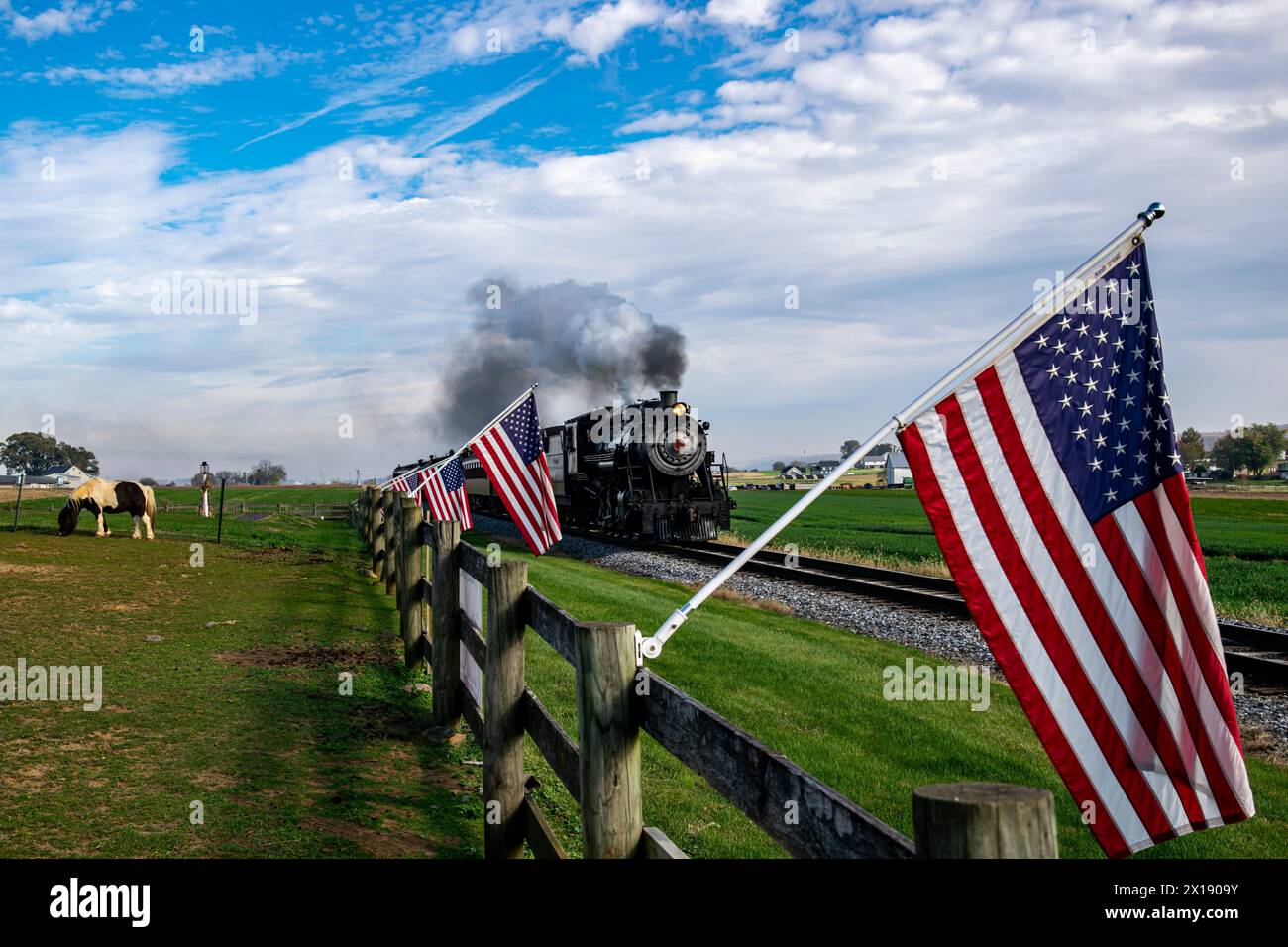 Ronks, Strasburg, November 4, 2023 - A vintage steam train chugs along ...